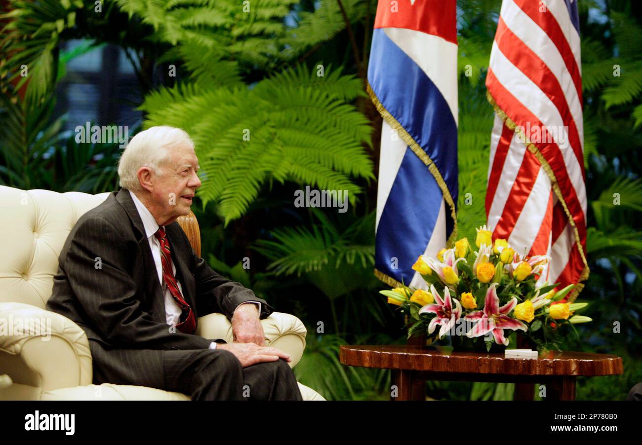 Former President Jimmy Carter listens to Cuba's President Raul Castro ...
