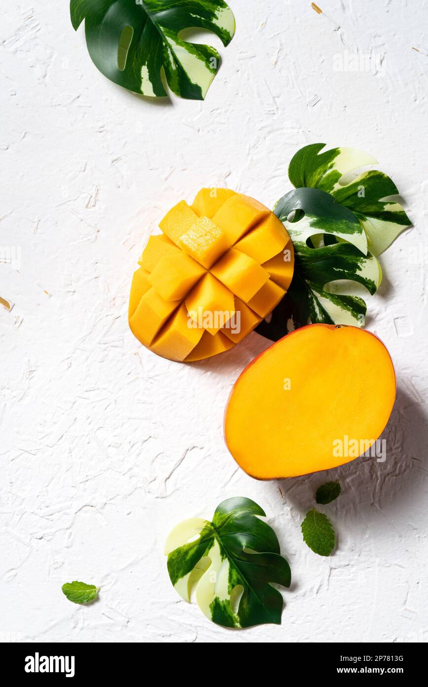 Mango background design concept. Top view of diced fresh mango fruit ...
