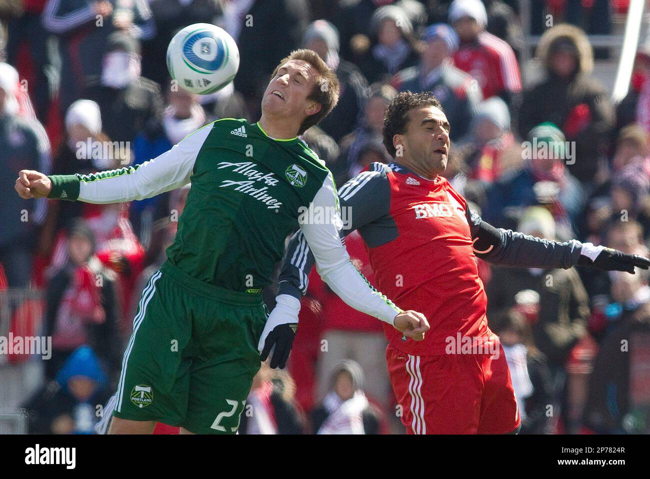 Toronto FC's Dwayne De Rosario, right, challenges Portland Timbers ...