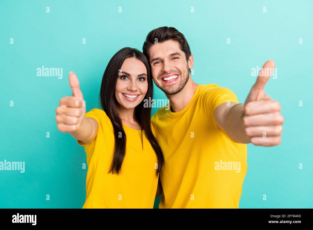 Photo of charming positive husband wife dressed yellow t-shirts ...