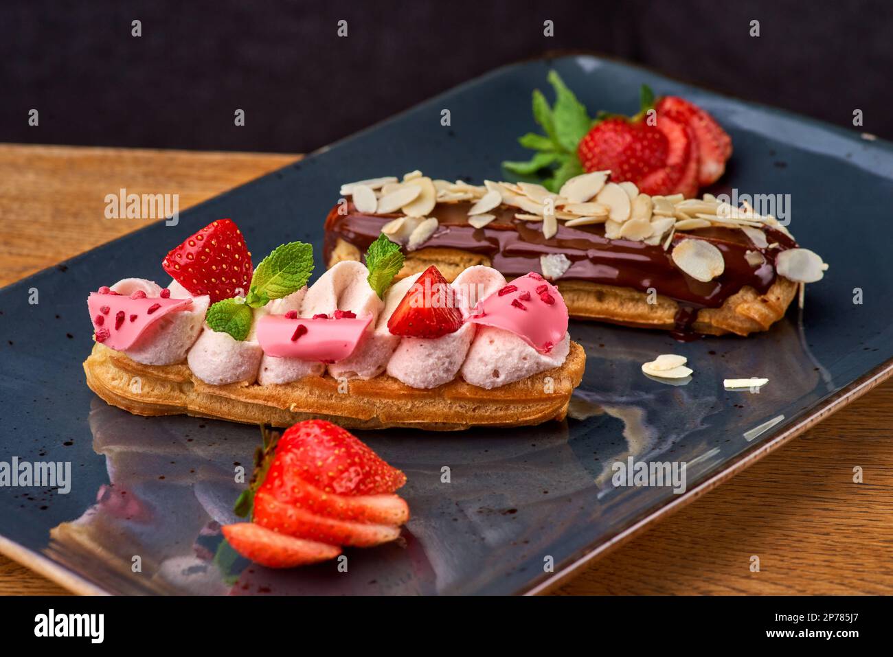 Set of french dessert eclairs. Traditional french eclairs with ...