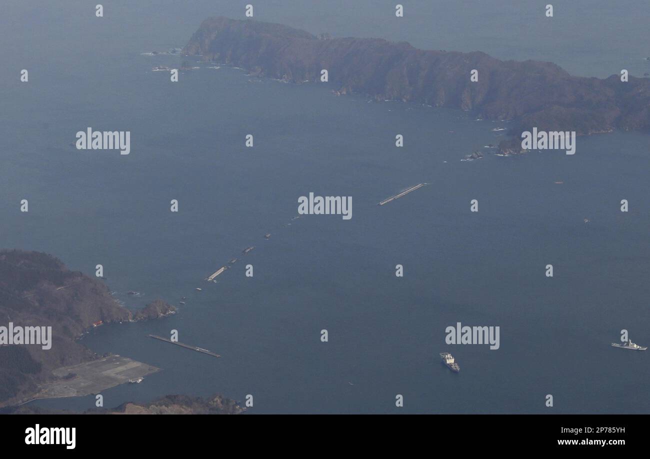 The breakwater, center, at Kamaishi port remains broken after the March ...