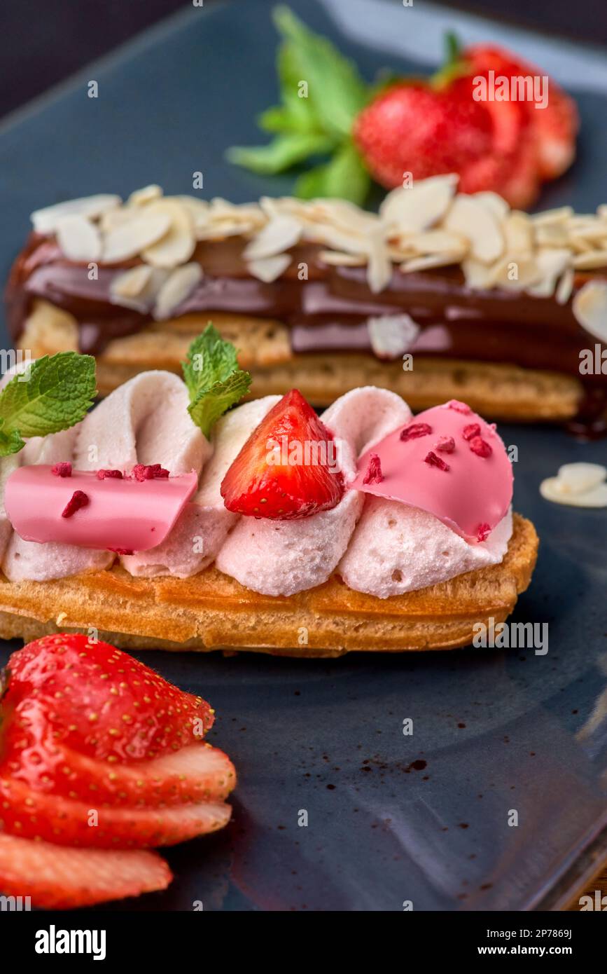 Set of french dessert eclairs. Traditional french eclairs with ...