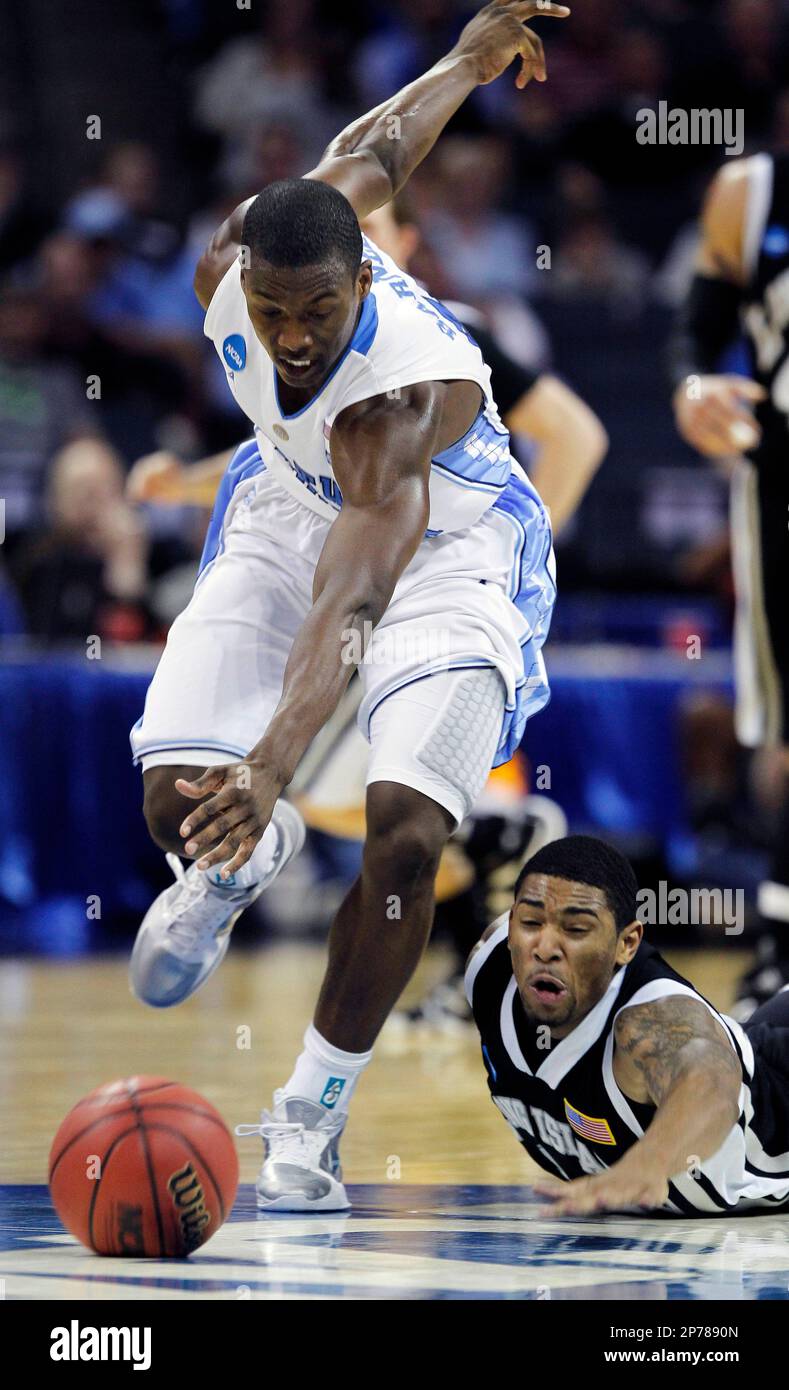 North Carolina forward Harrison Barnes, left, chases a loose ball as ...