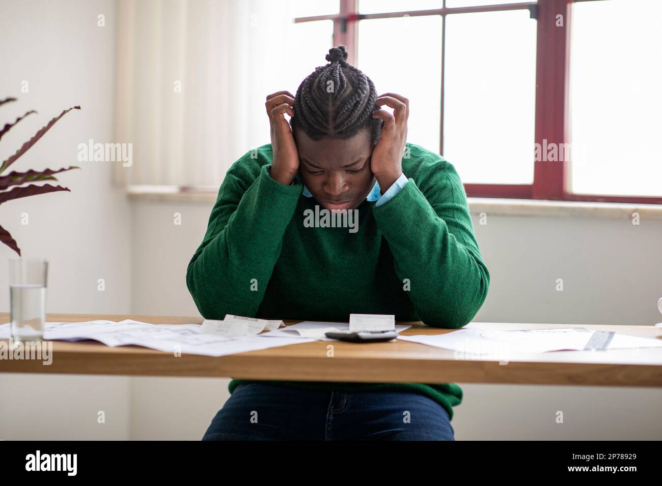 Desperate African Man Calculating Bills Having Financial Problems In ...