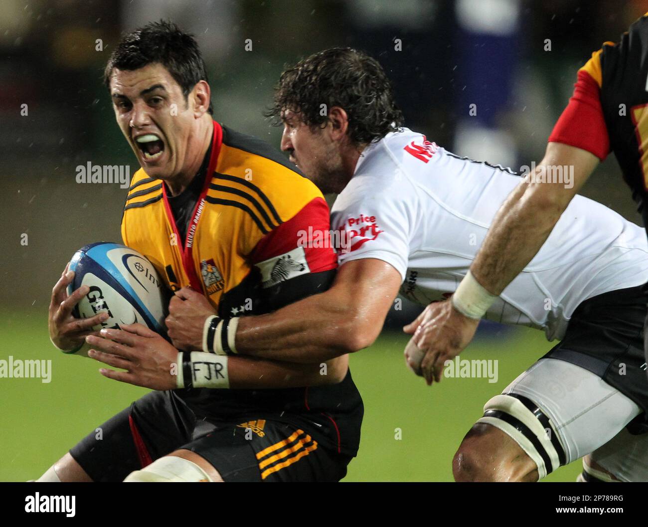Chiefs' Isaac Ross, left, is tackled by Sharks' Ryan Kankowski in a ...
