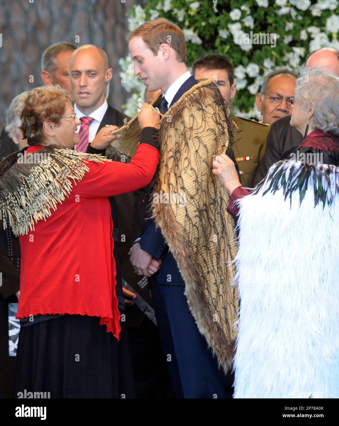 Prince William, center, receives a maori cloak on his arrival at the ...