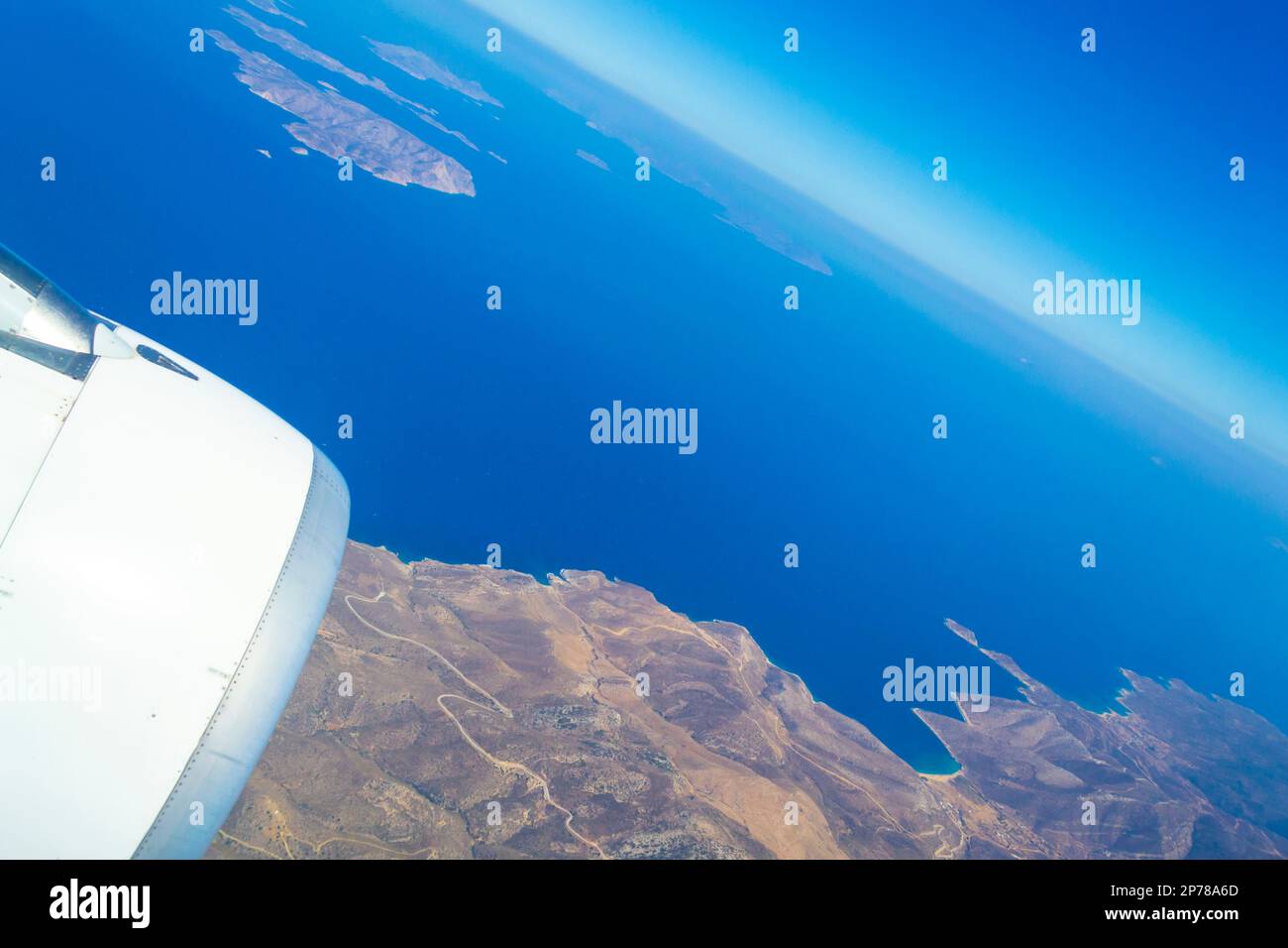 Aerial view of Ios island seen from flying airplane to Santorini.Ios ...