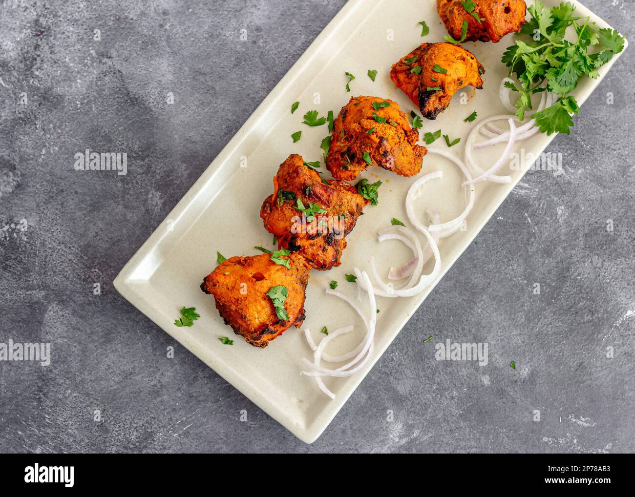 Indian Chicken Appetizer, Chicken Tikka Garnished with Onion and ...