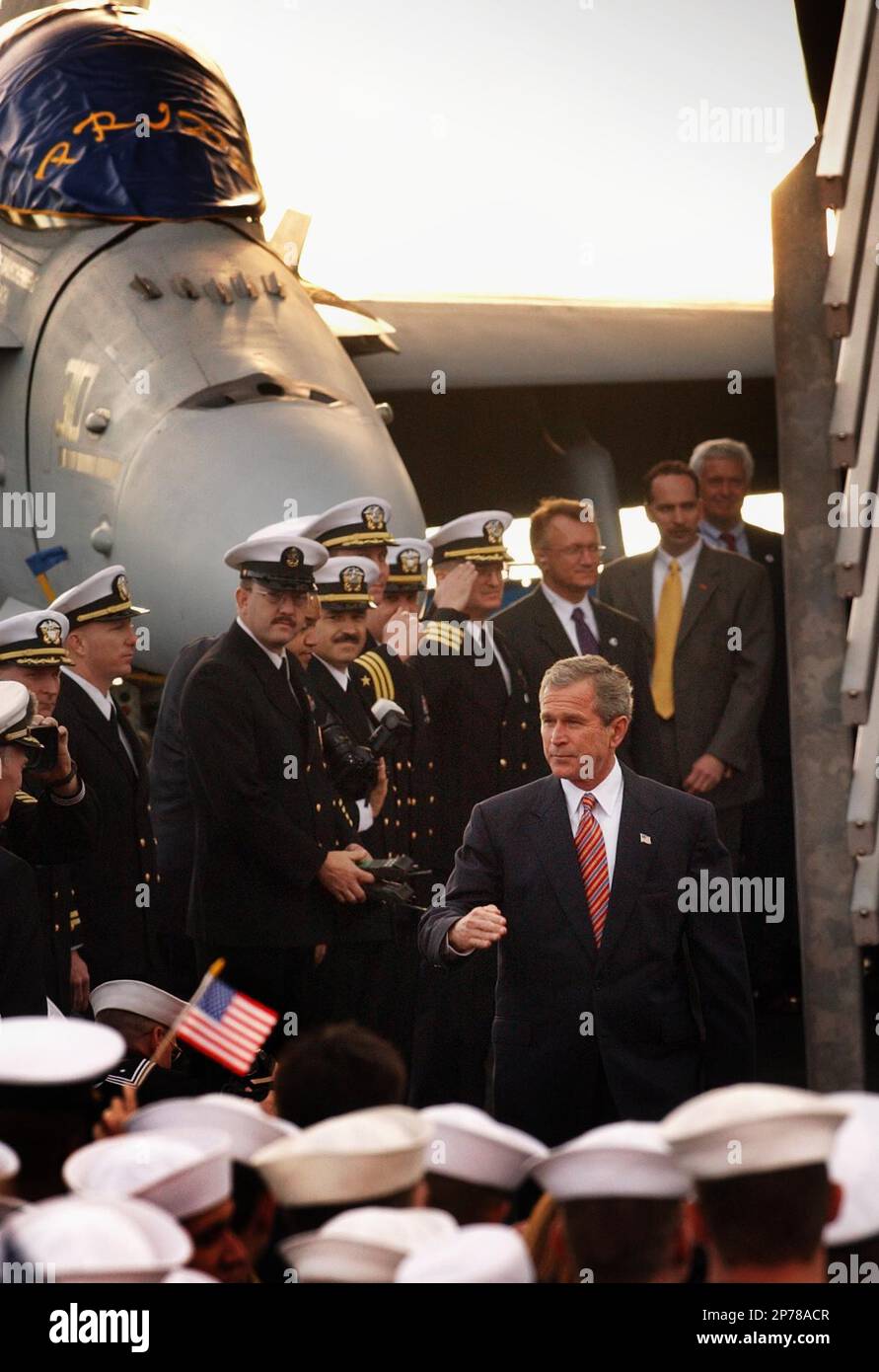 As milittary personnel cheered, U.S. President George W. Bush, makes ...