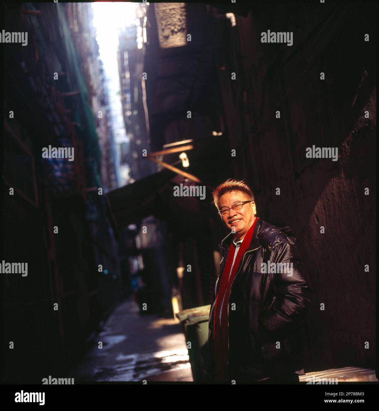 Hong Kong actor Ng Man Tat poses for photos in an alley in Kwun Tong ...