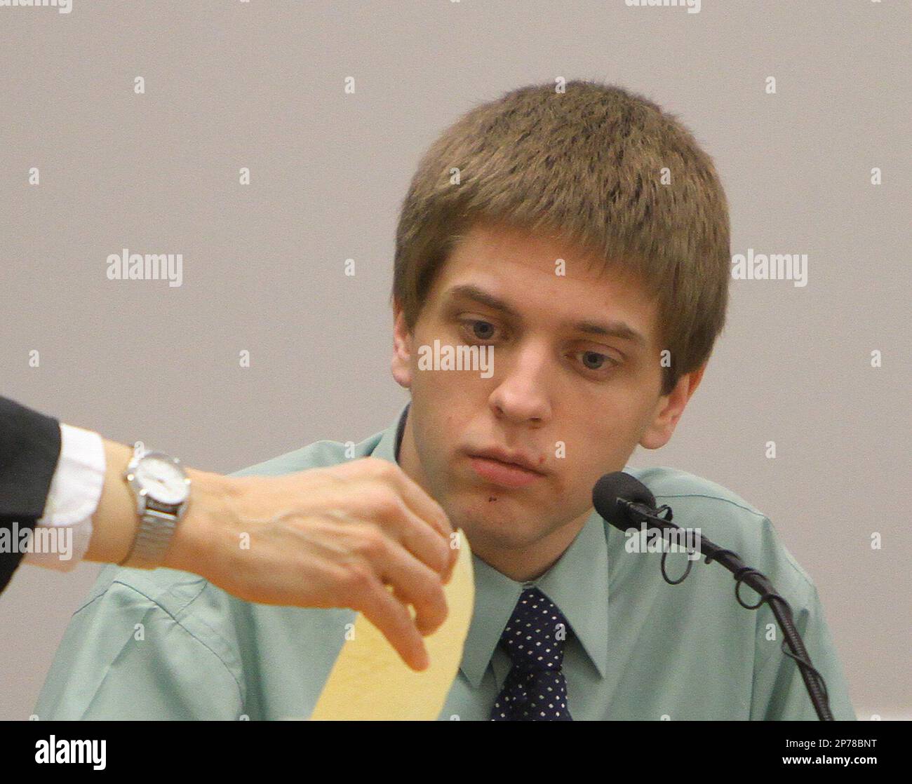 Prosecutor Jeff Strelzin showsa receipt for pawned jewelry stolen from ...