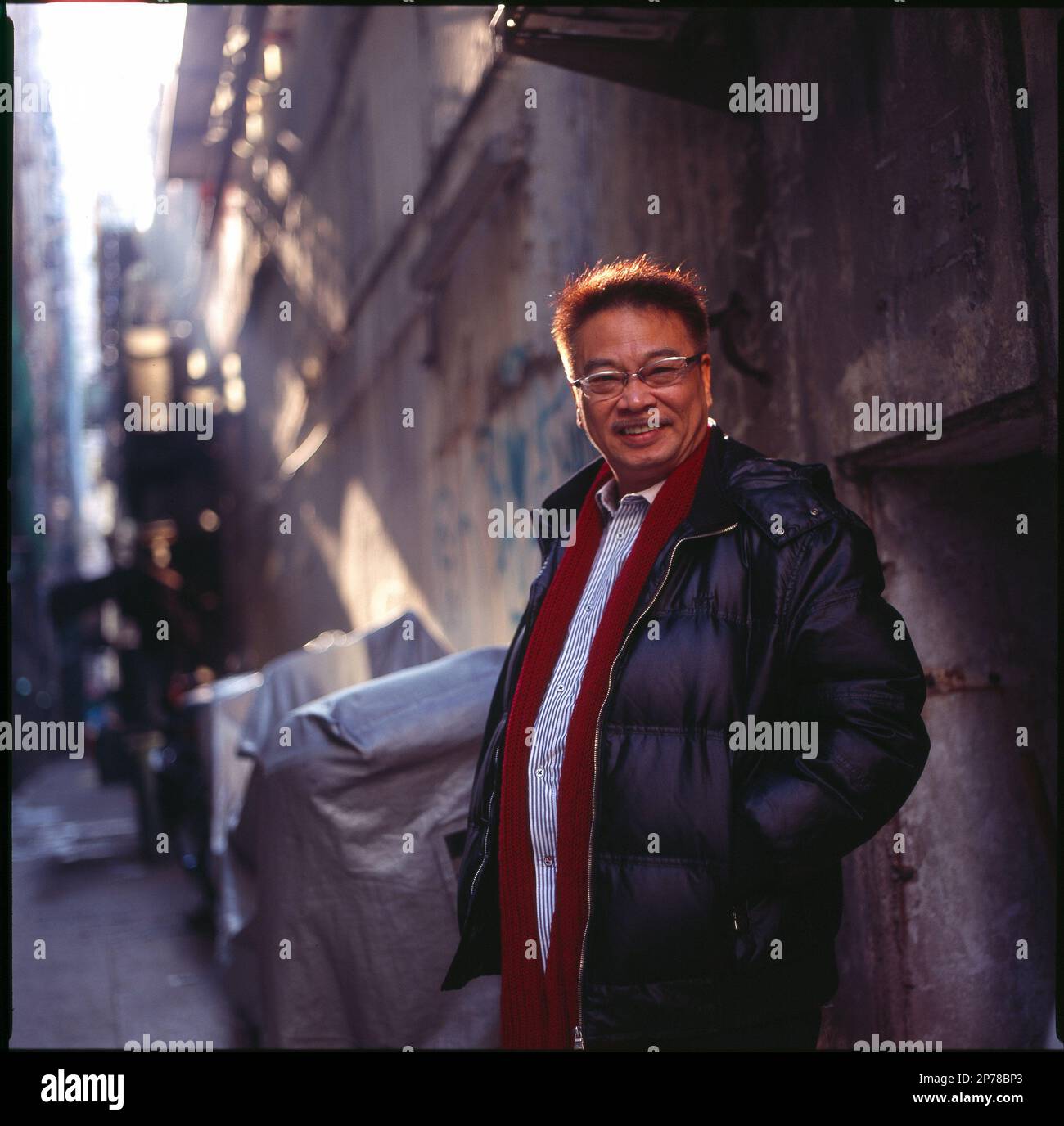 Hong Kong actor Ng Man Tat poses for photos in an alley in Kwun Tong ...