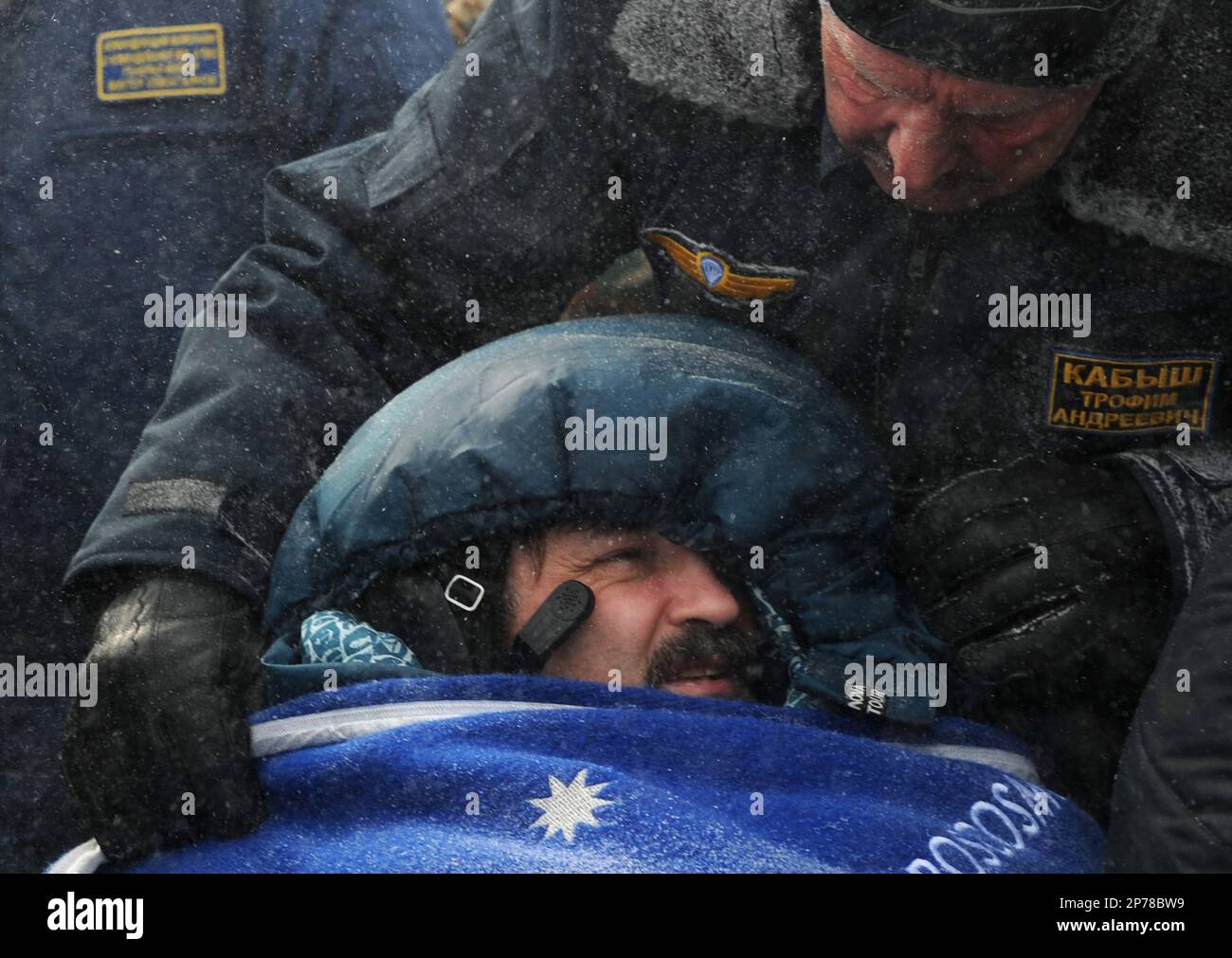 Russian space agency rescuers help Russian cosmonaut Alexander Kaleri ...