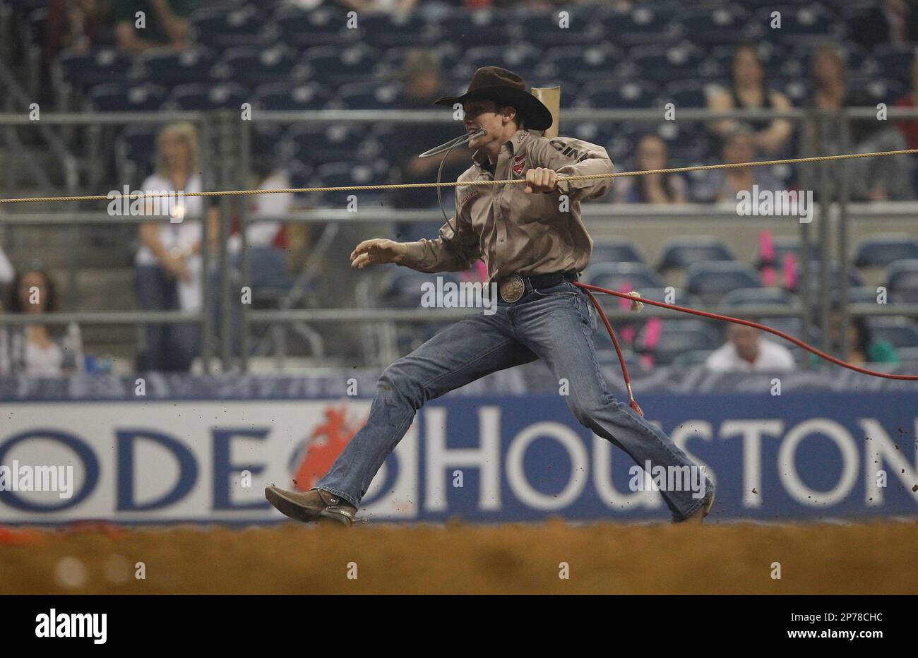 Tuf Cooper competes during the tie-down roping competition prior to the ...