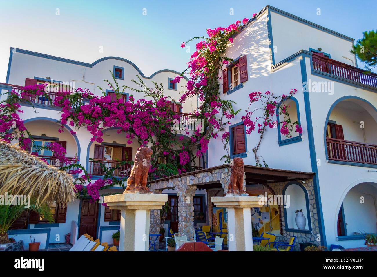 Pretty traditional house with beautiful flowering shrubs in front in ...