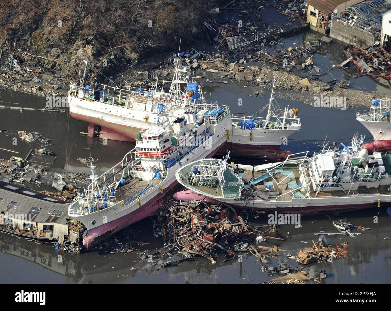Ships are washed away by a huge tsunami, in Kesennuma, Miyagi ...