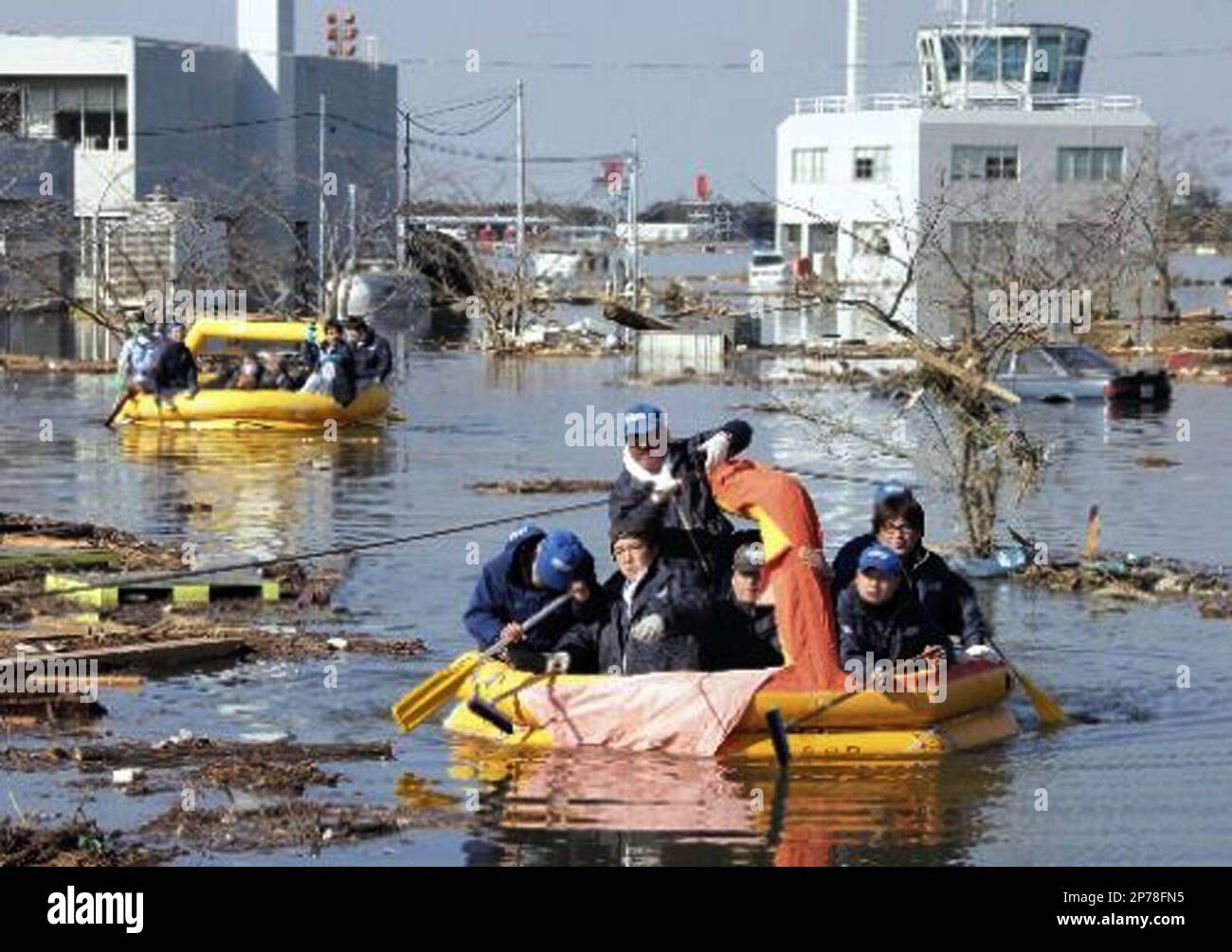 People who were stranded at the submerged Sendai airport are evacuated ...