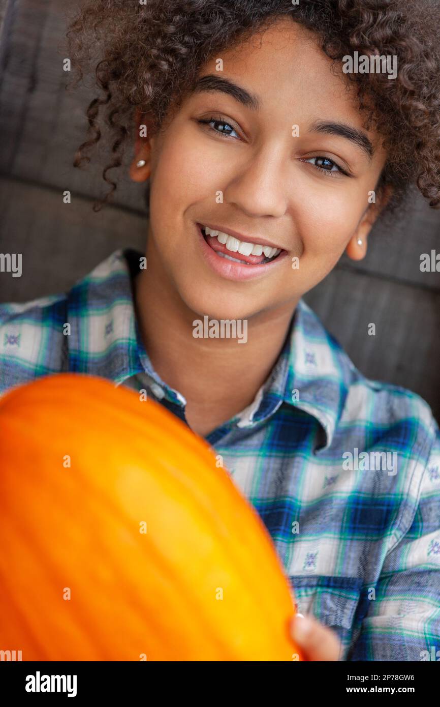 African American biracial girl female child happy smiling holding a ...