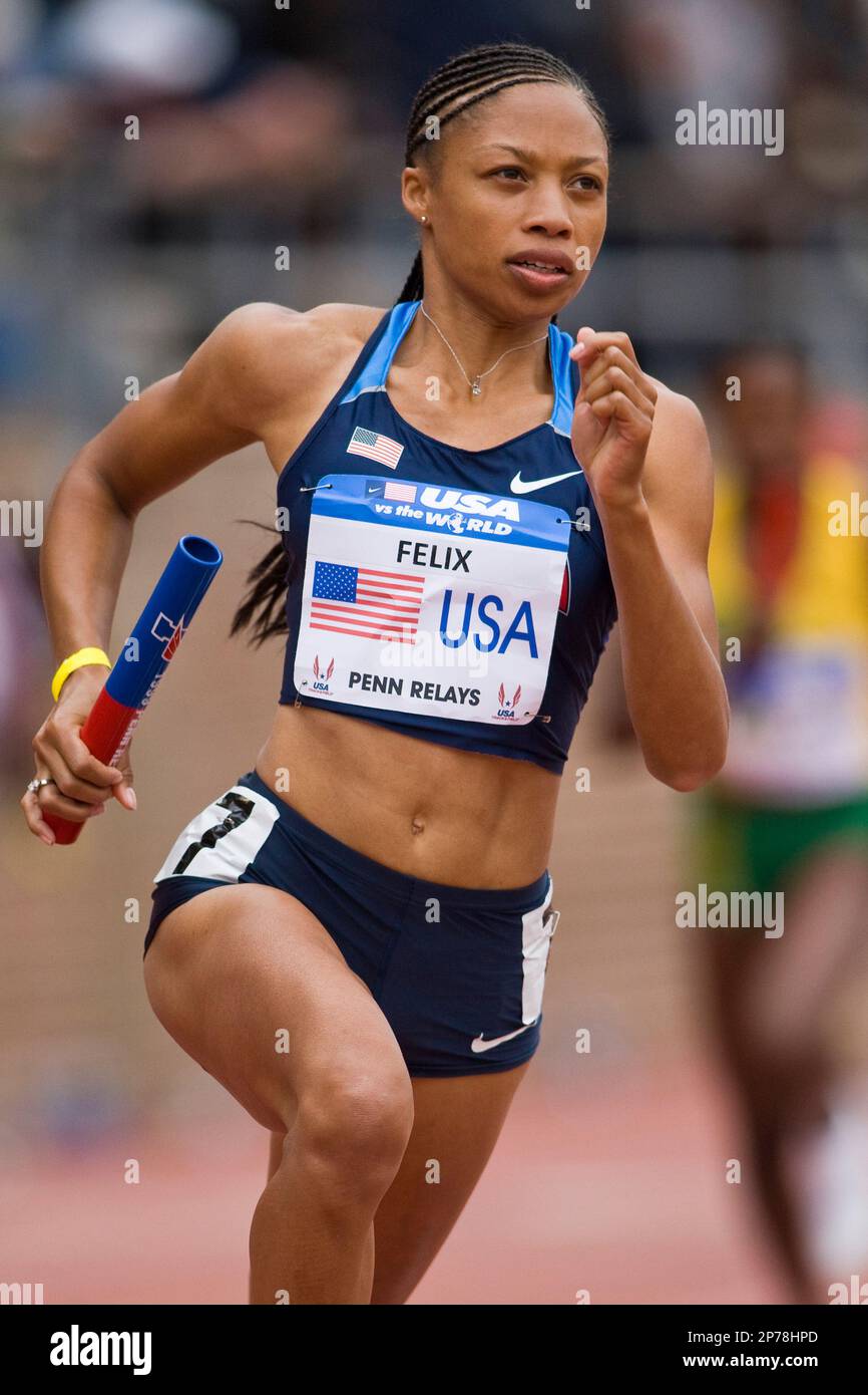 Allyson Felix, anchor of the 4x400 USA Blue team runs to victory with a ...