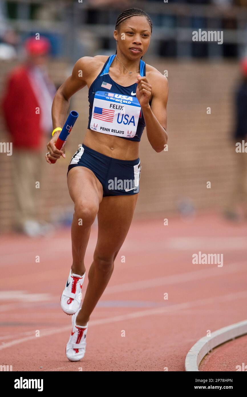 Allyson Felix, anchor of the 4x400 USA Blue team runs to victory with a ...