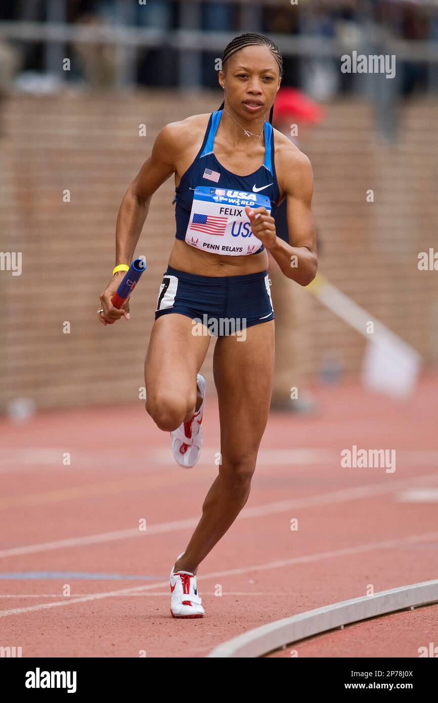 Allyson Felix, anchor of the 4x400 USA Blue team runs to victory with a ...