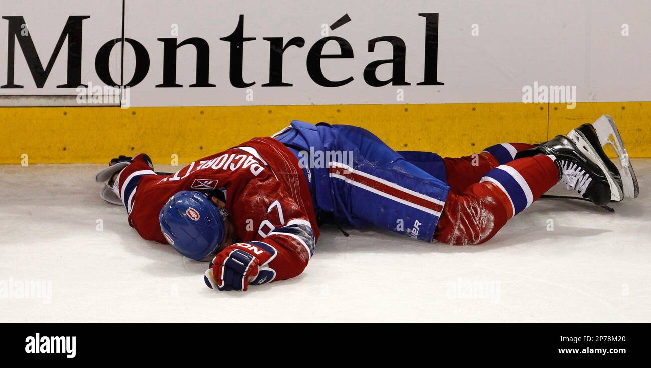 Montreal Canadiens' Max Pacioretty lays on the ice after taking a hit ...