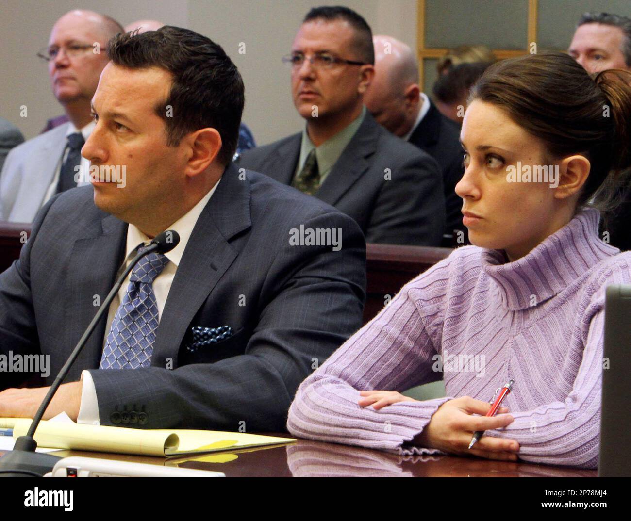Attorney Jose Baez, left, and his client Casey Anthony listen to ...