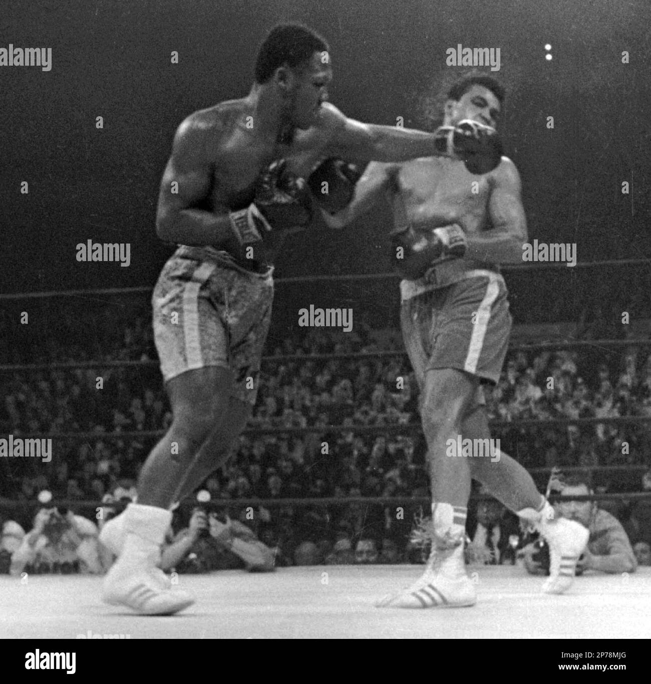 FILE - In this March 8, 1971, file photo, Muhammad Ali takes a left ...