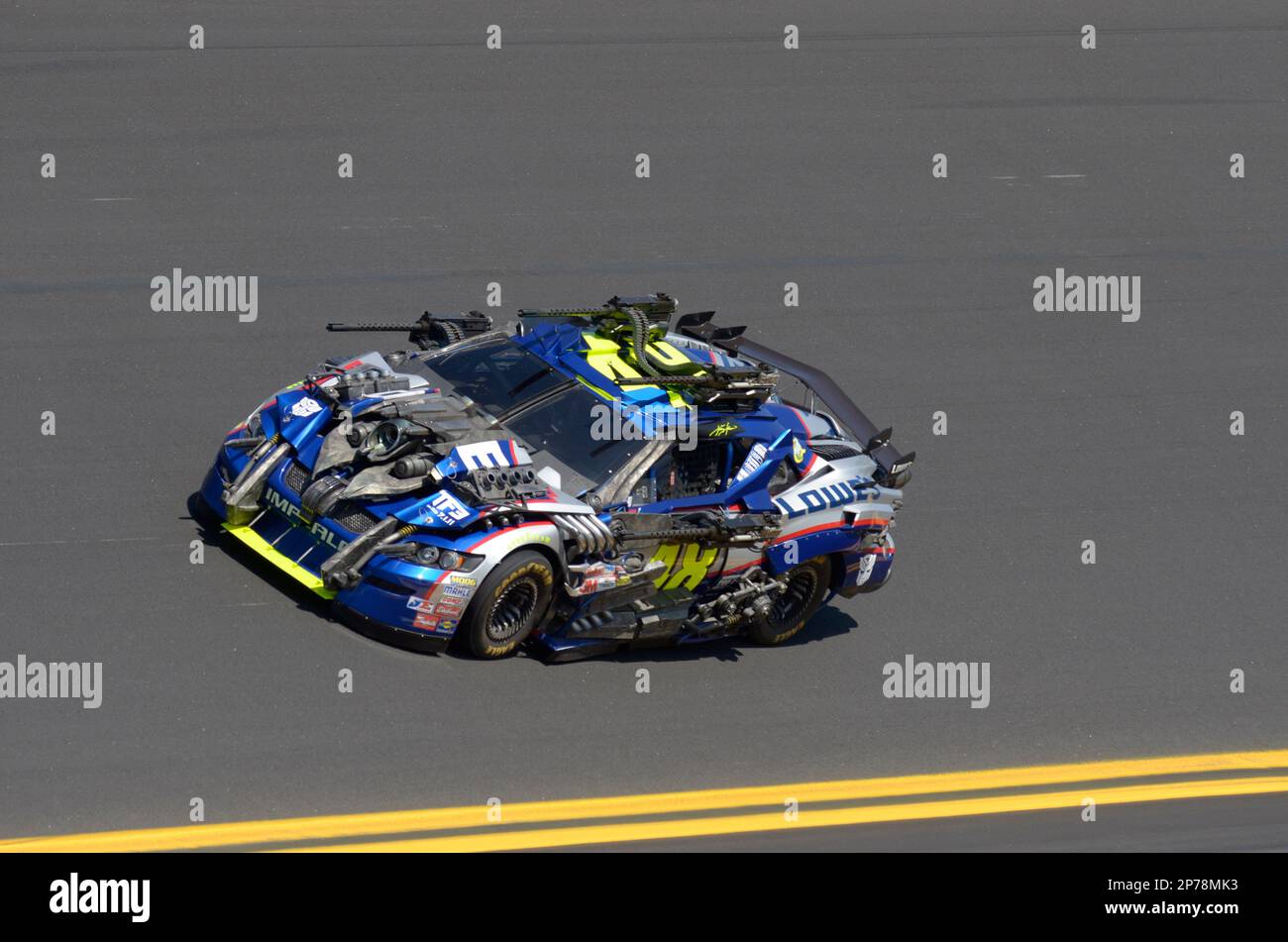 A Transformer car passes through turn 4 on the parade lap of the ...