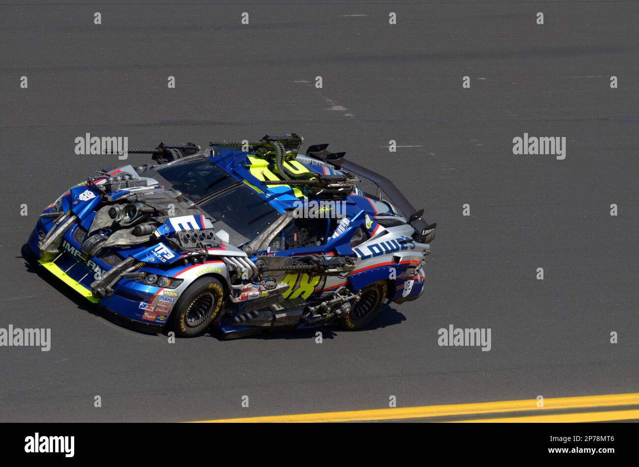 A Transformer car passes through turn 4 on the parade lap of the ...
