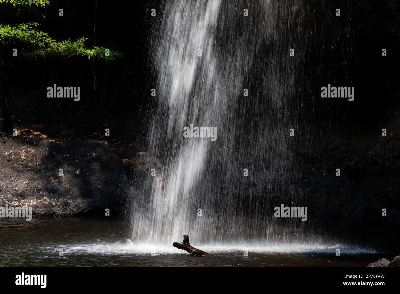 Long speed shutter technique of splashing waterfall drop on pond with ...