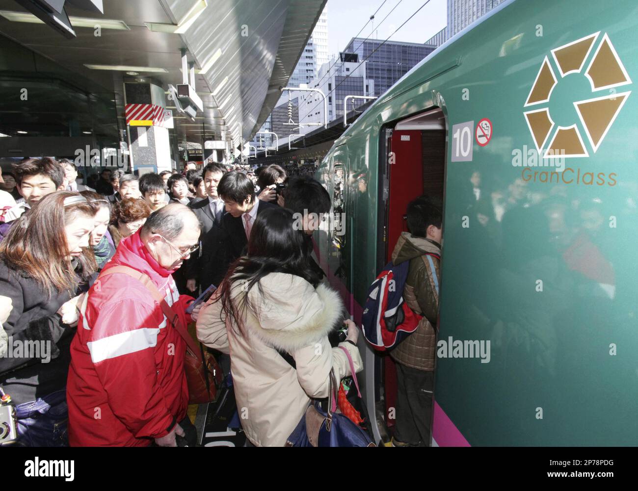 Passengers get on the Gran Class, luxury seats of "Hayabusa'', a new ...