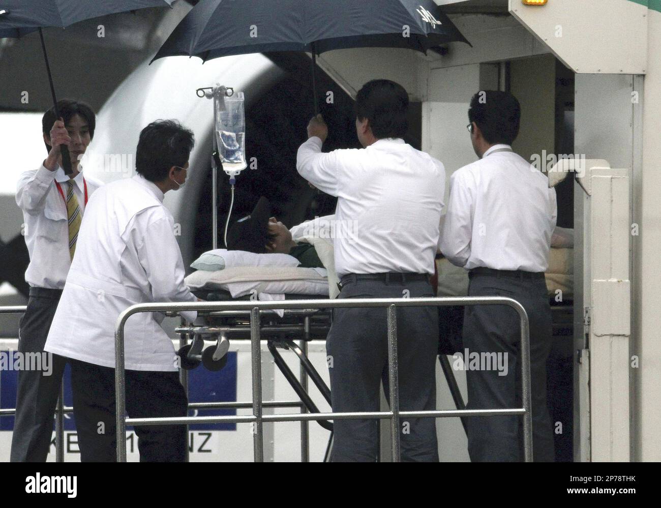 Kento Okuda, is taken to an ambulance after arriving at Japan, Feb. 28 ...