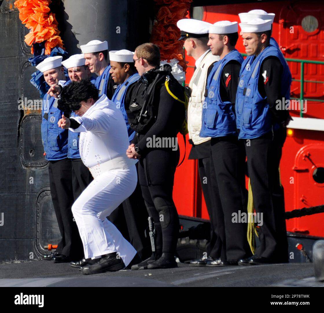 Elvis, played by Fire Control Chief Brian Paugh, poses as the Los ...