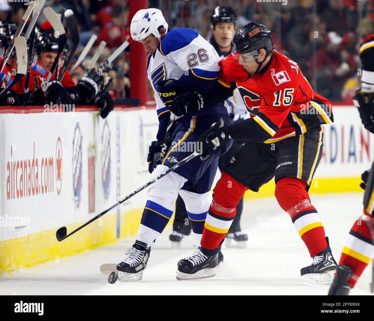 St. Louis Blues' B.J. Crombeen, left, battles Calgary Flames' Tim ...