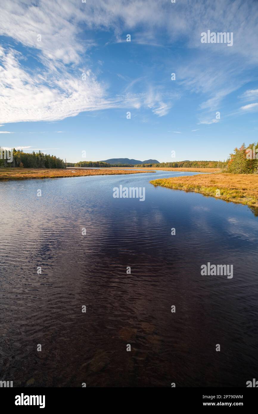 Wide angle shot of a lake in Acadia National Park with deep colours ...