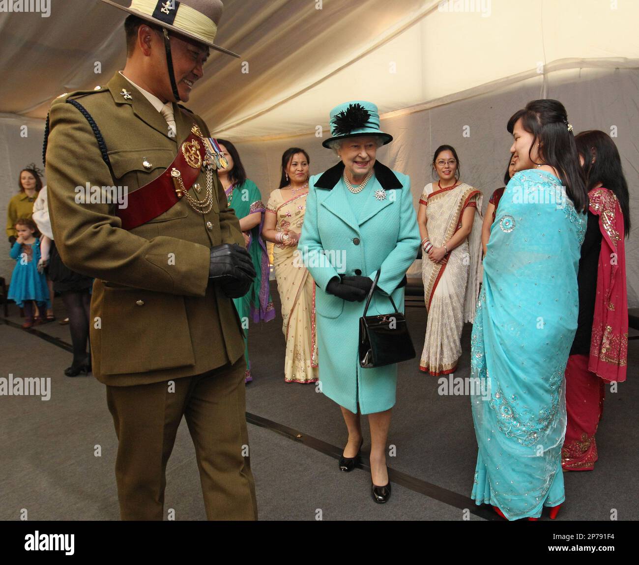 Britain's Queen Elizabeth II meets wives of serving Gurkha servicemen ...