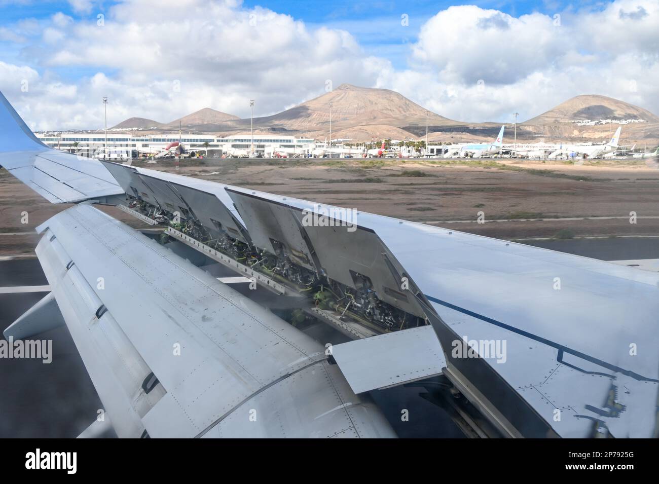 A wing of a Boeing 737 TUI chartered airplane taken landing at ...