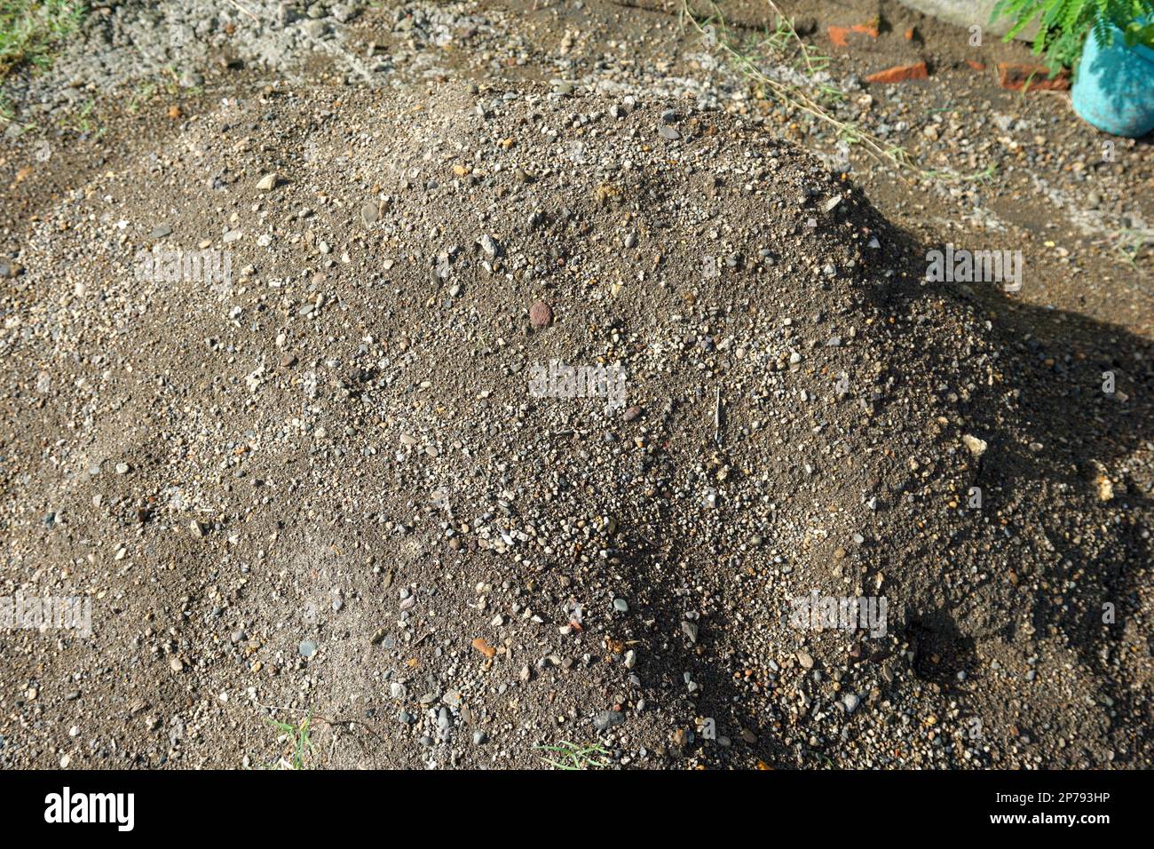 small mounds of black sand and wet gravel Stock Photo - Alamy