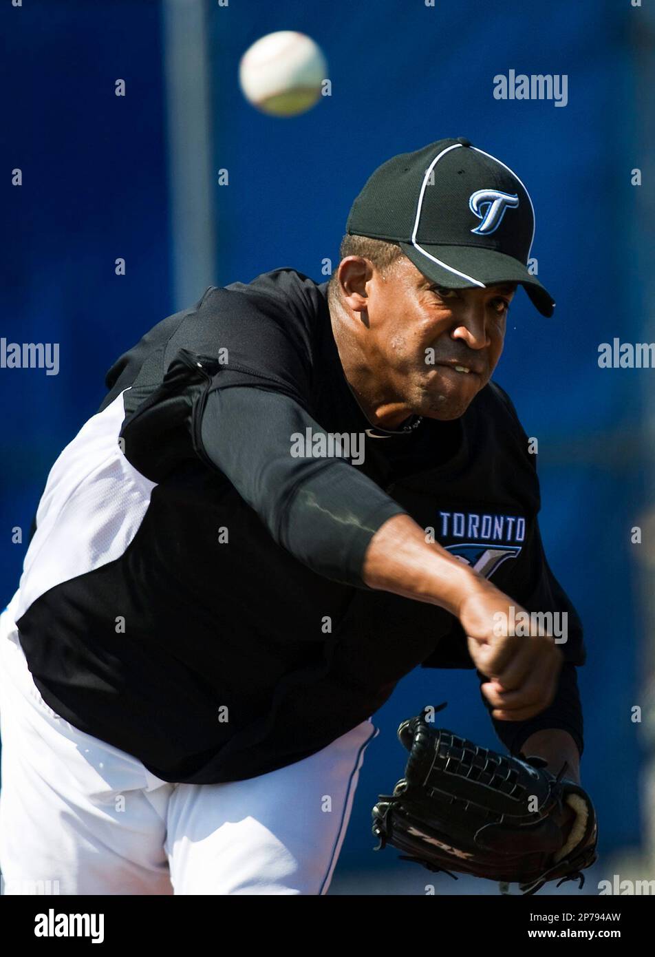 Toronto Blue Jays pitcher Octavio Dotel throws during baseball spring ...