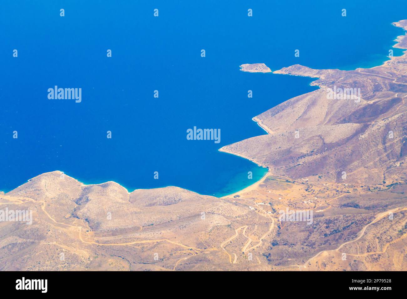 Aerial view of Ios island seen from flying airplane to Santorini.Ios ...