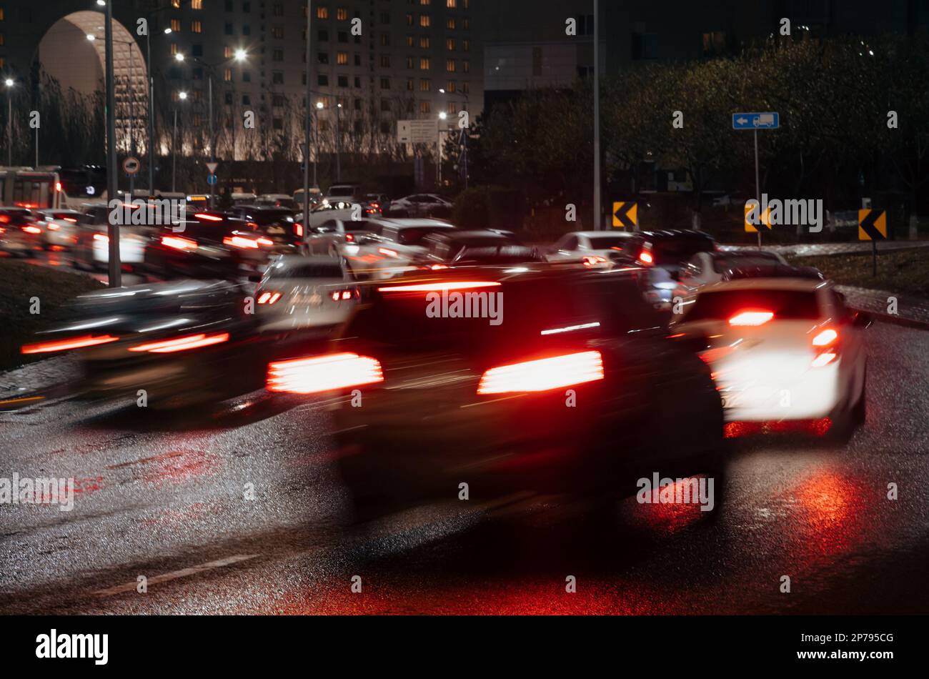 Evening car traffic in a big city. Cars in motion and standing in ...