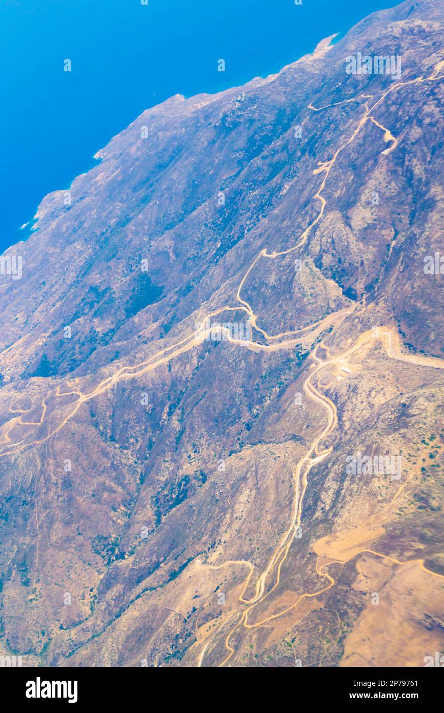 Aerial view of Ios island seen from flying airplane to Santorini.Ios ...