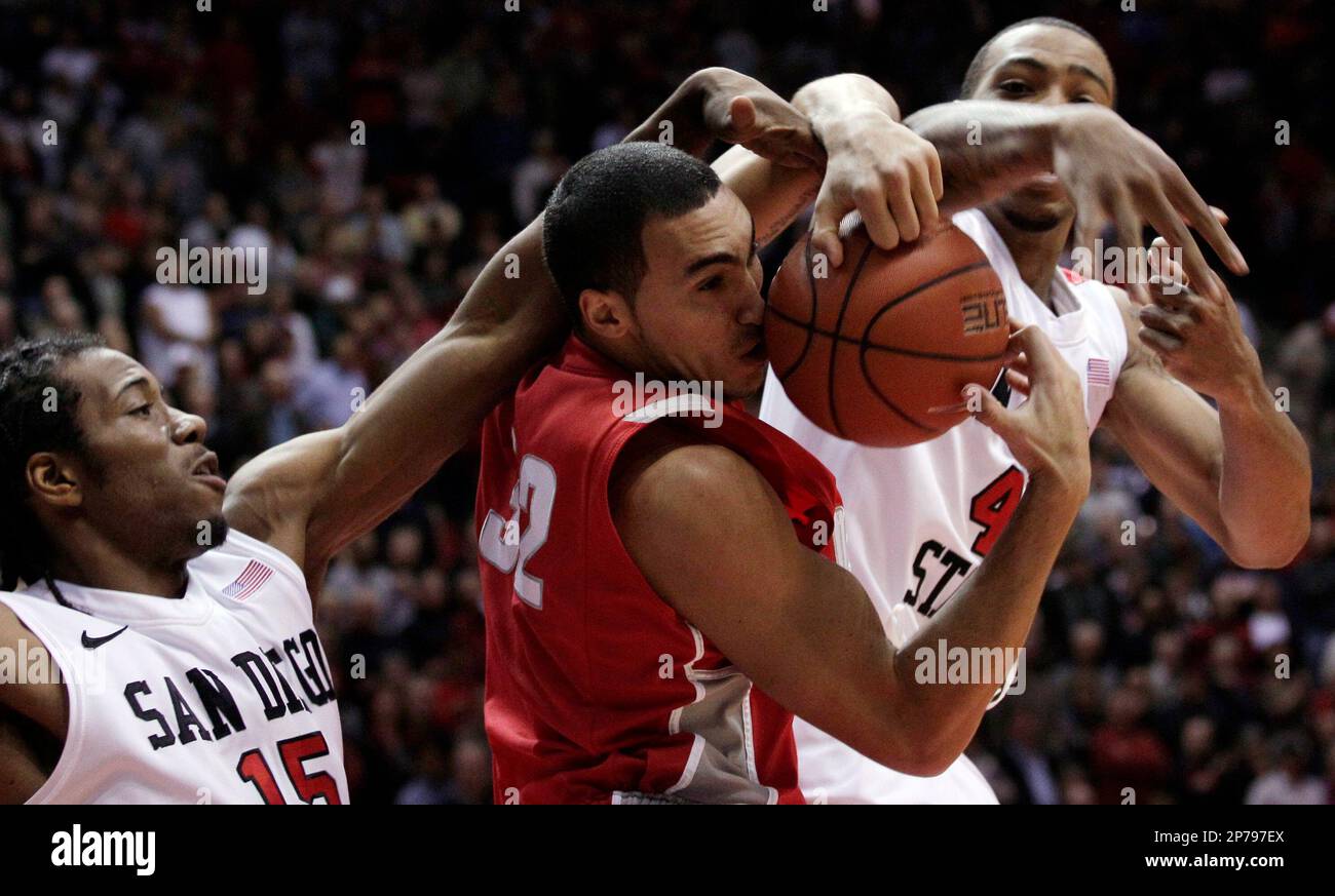 New Mexico's Drew Gordon, center, works for the ball against San Diego ...