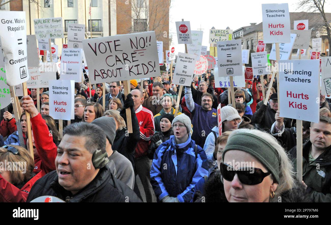 Area residents turn out during a rally to protest Governor Scott Walker ...