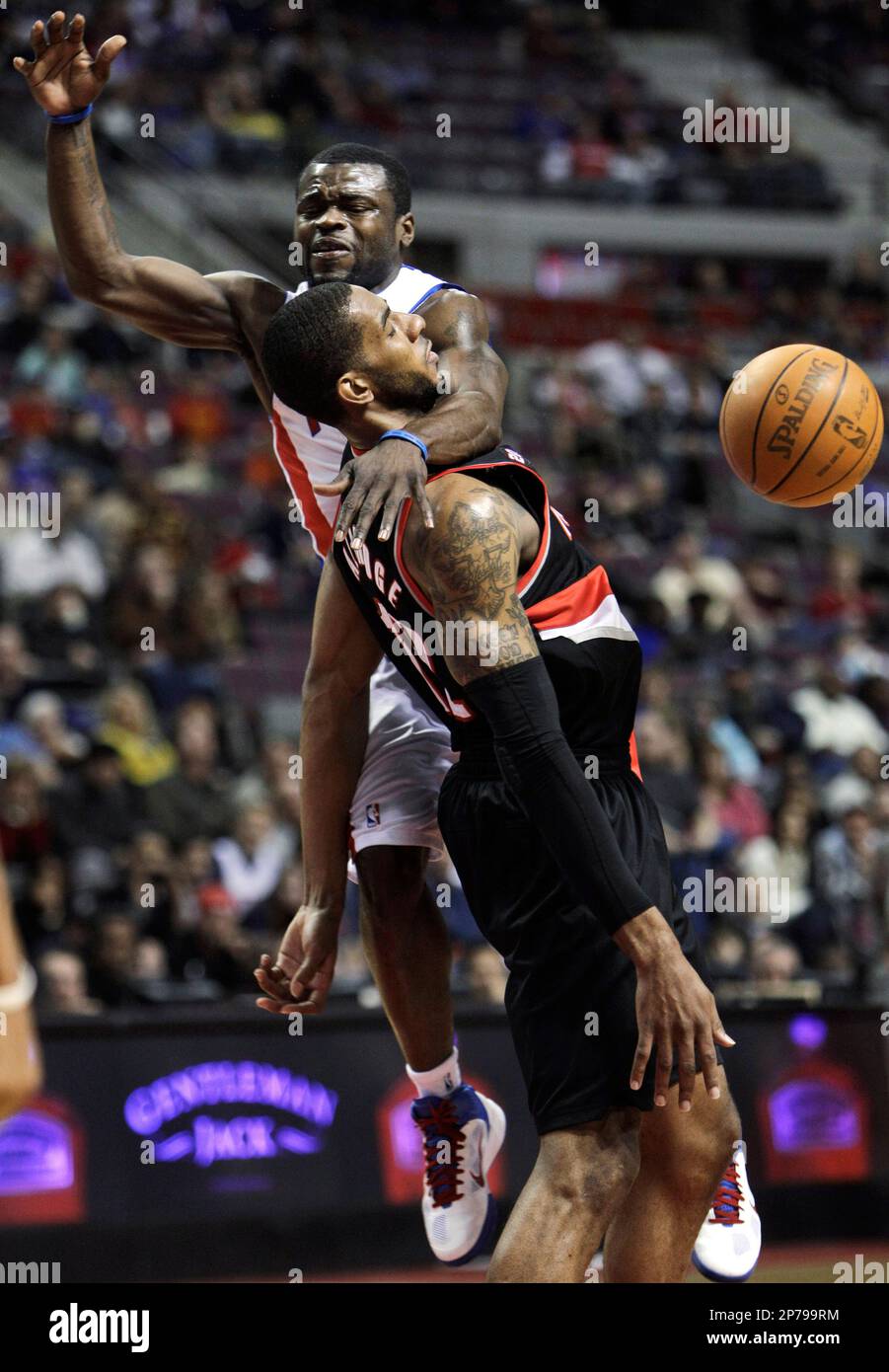 Detroit Pistons guard Will Bynum, rear, fouls Portland Trail Blazers ...