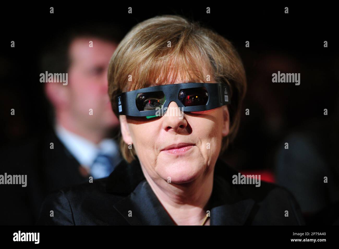 German Chancellor Angela Merkel wears 3D glasses prior to the screening ...