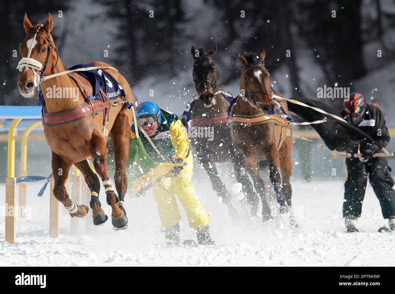 First placed Franco Moro, pulled by Bergonzi, left, competes during the ...