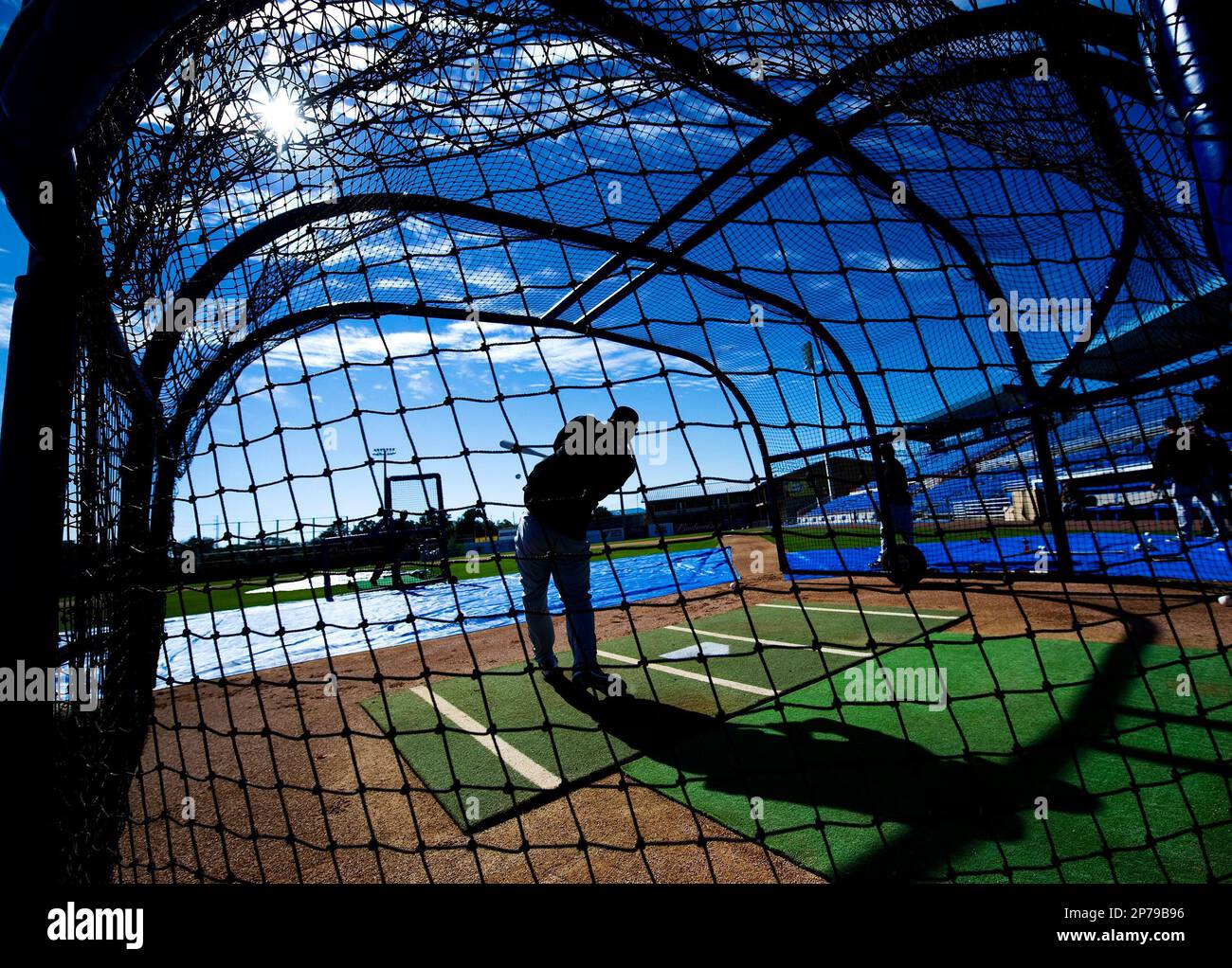 Toronto Blue Jays infielder Brett Lawrie is silhouetted while hitting ...